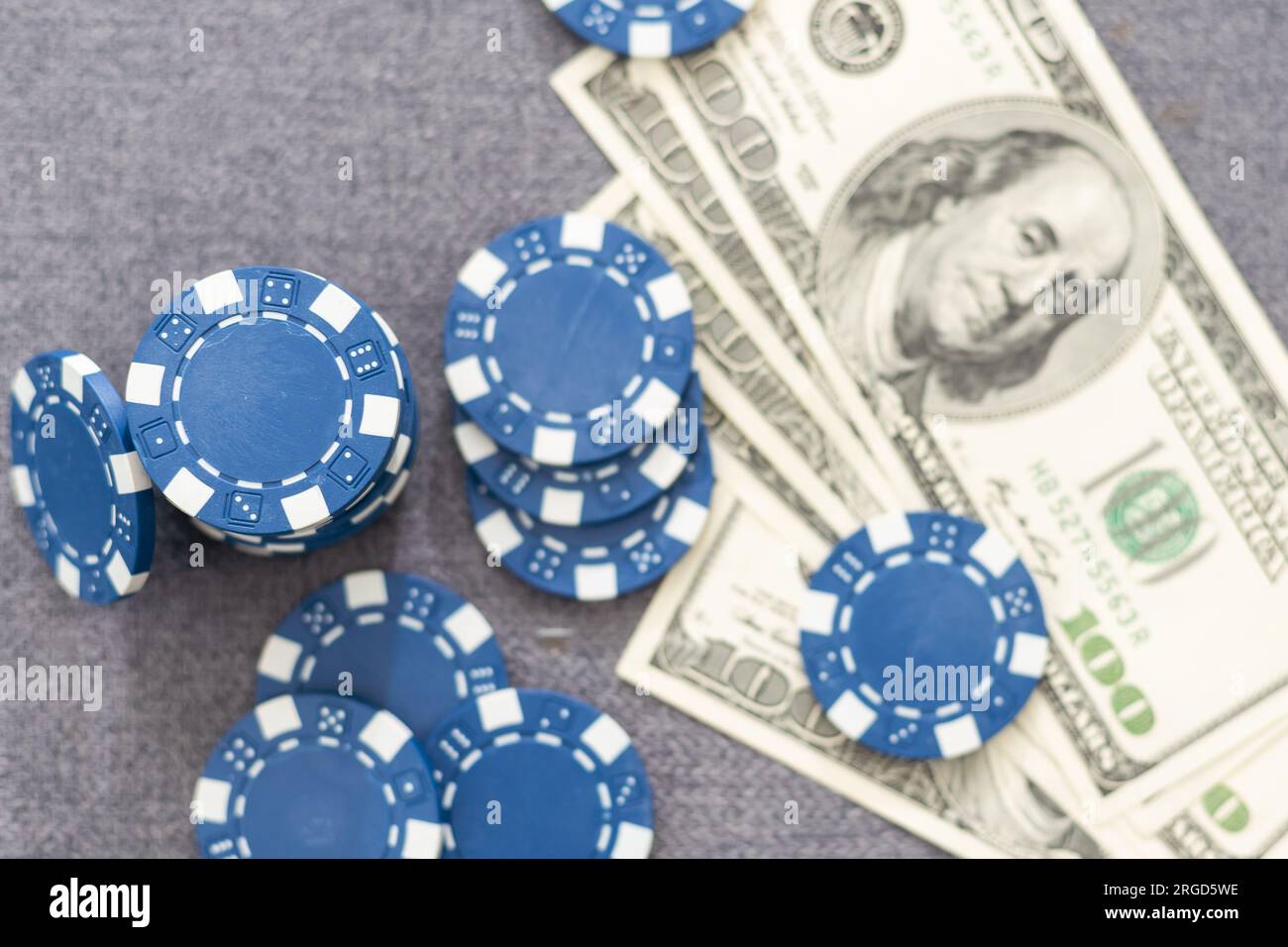 Blue poker chips on stock market chart background Stock Photo - Alamy