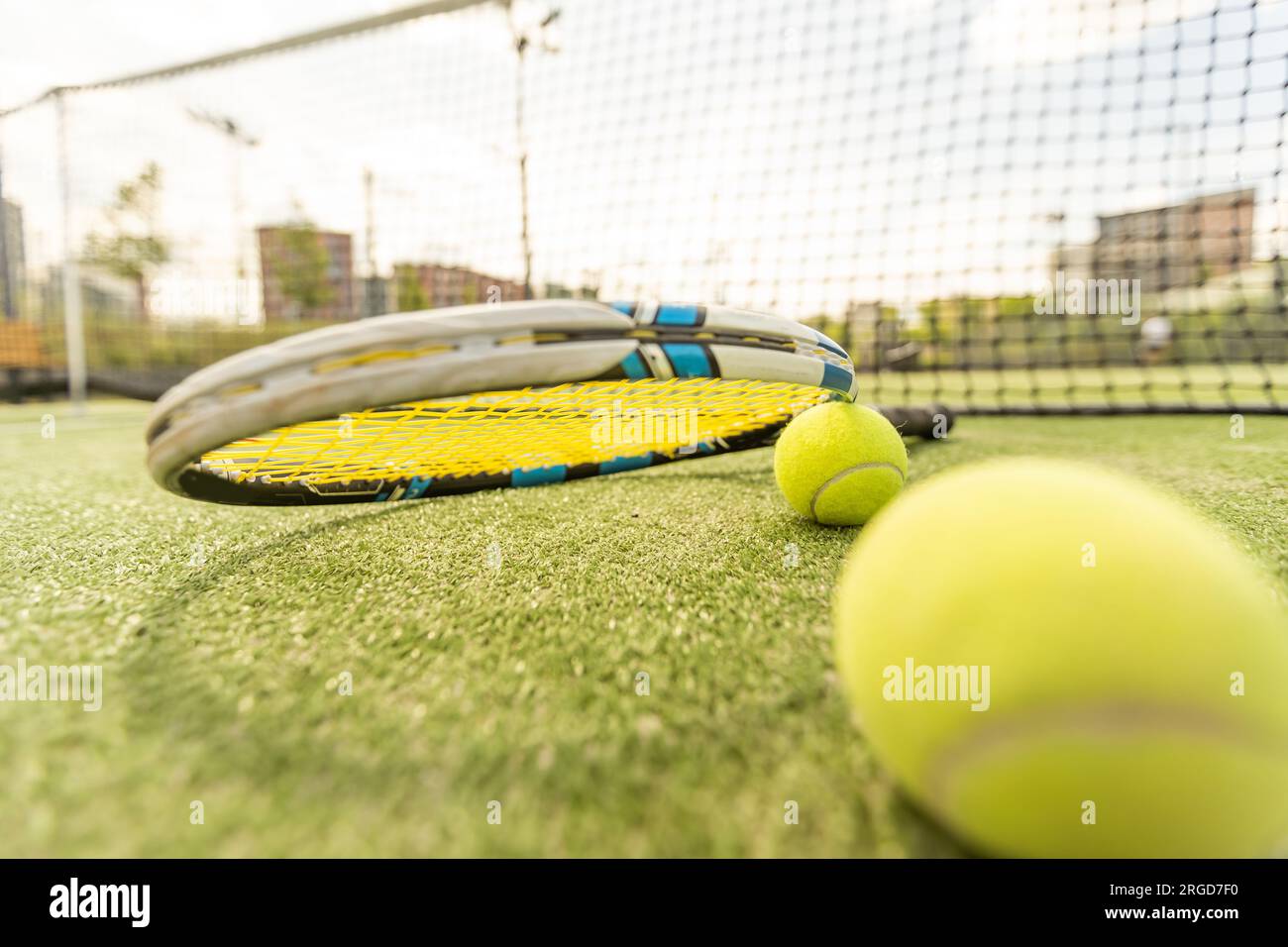 tennis racket with a tennis ball on a tennis court Stock Photo - Alamy