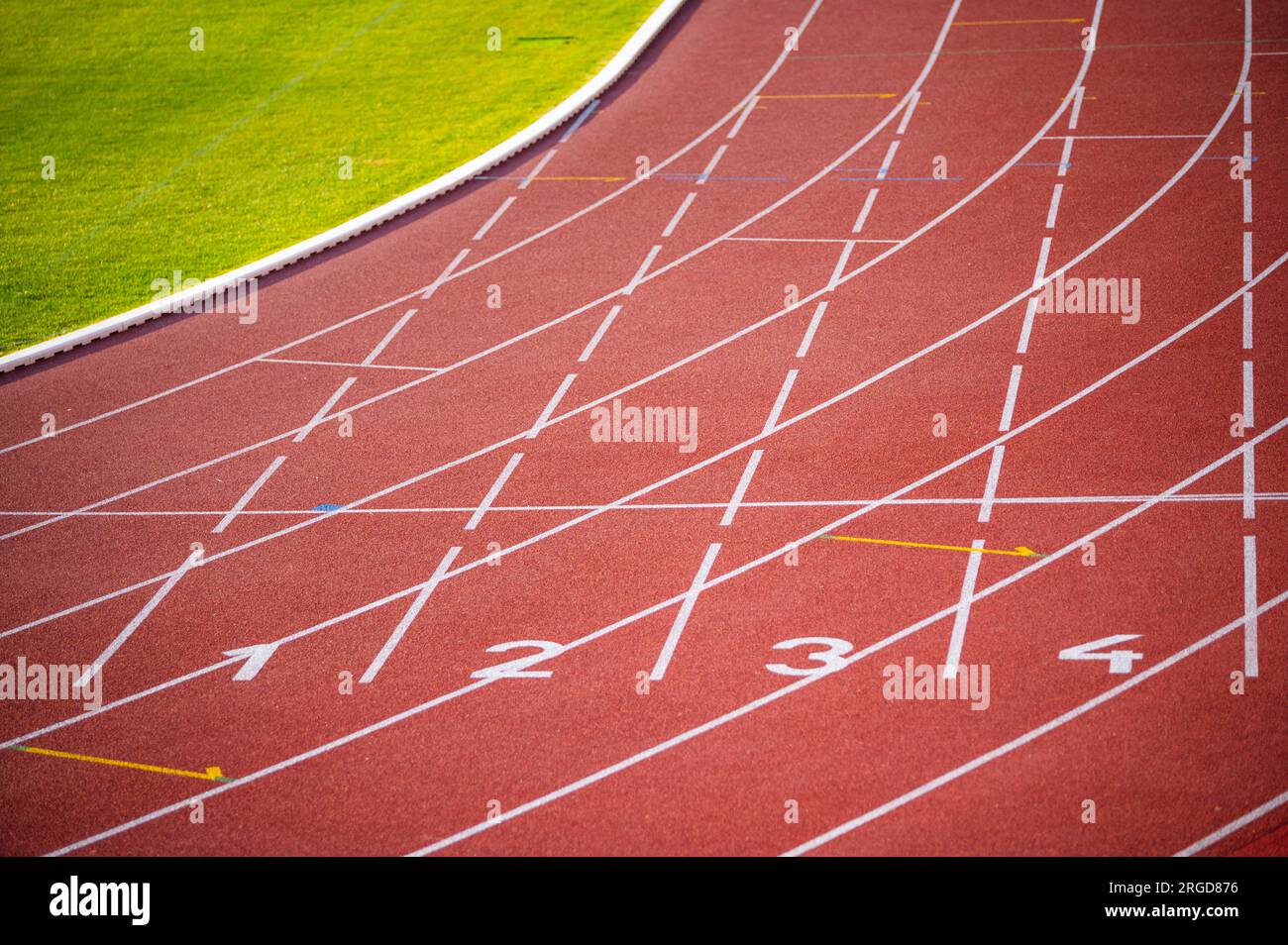 Geometry of White Lines and Numbered Lanes on the Bold Canvas of a Red ...