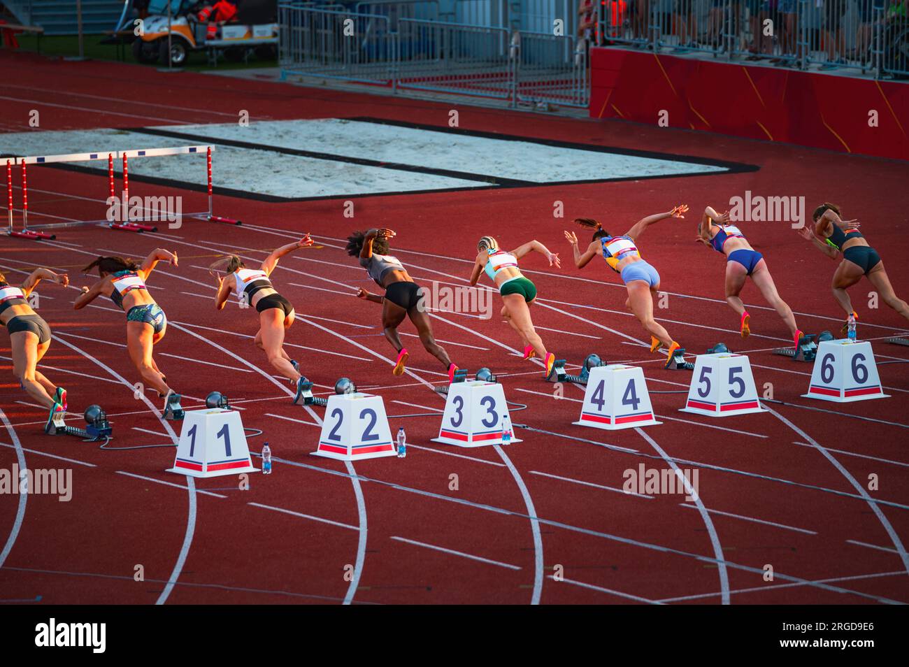 Female Sprinters Propel Themselves Down the Track in the Initial ...