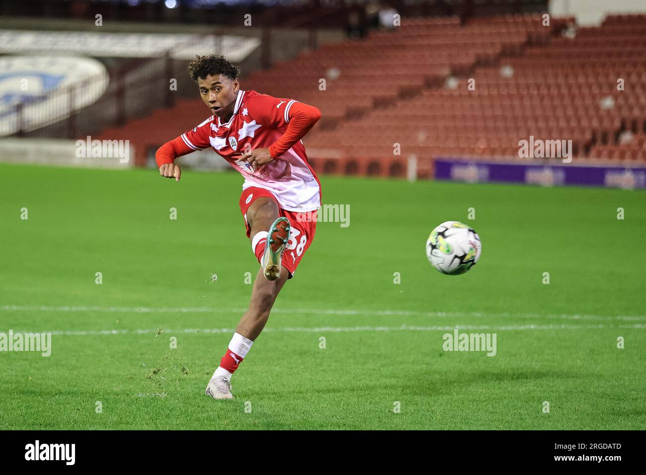 Theo Chapman #38 of Barnsley scores a penalty during the Carabao Cup ...