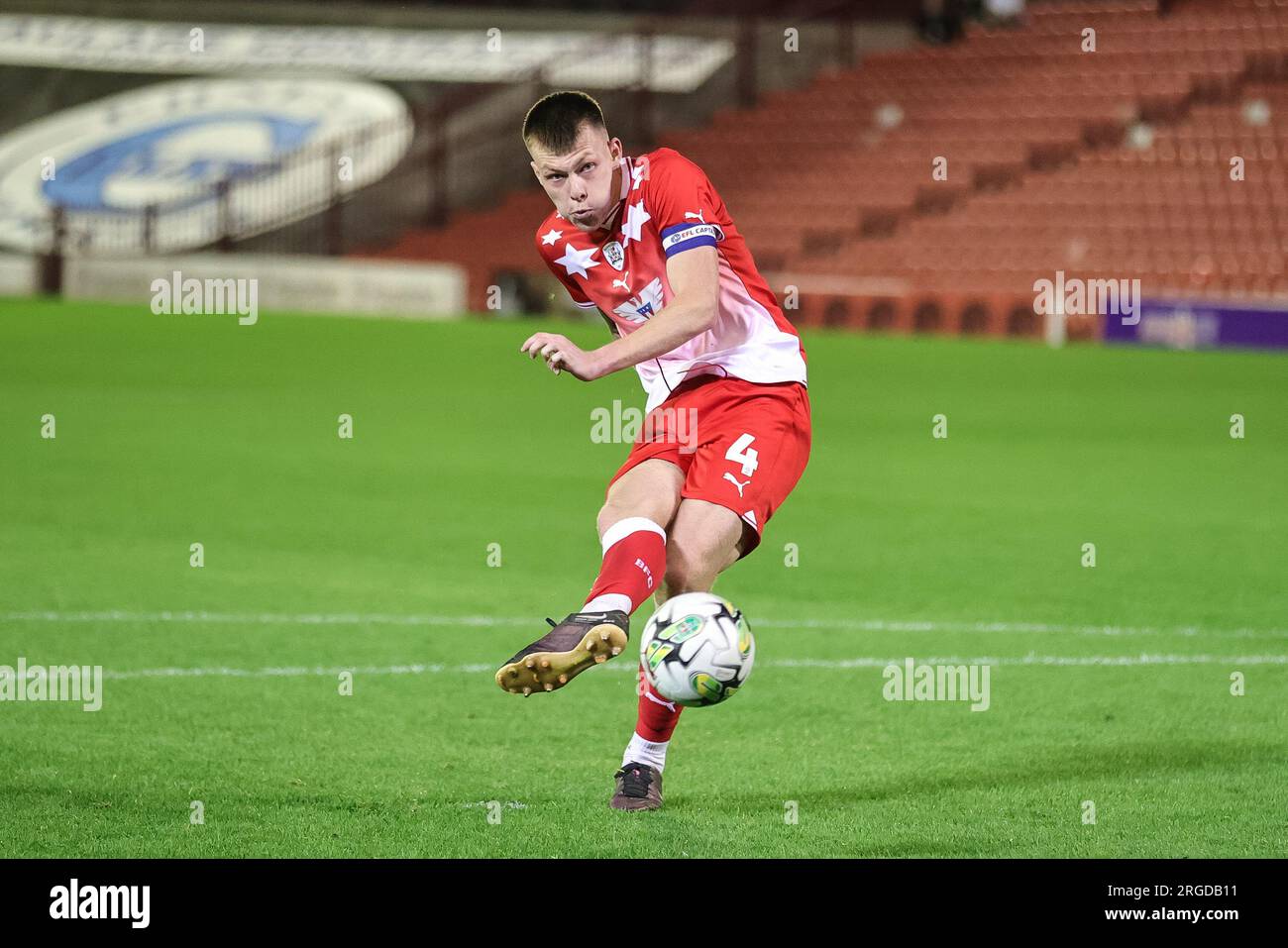 Kacper Lopata #4 of Barnsley scores a penalty during the Carabao Cup ...