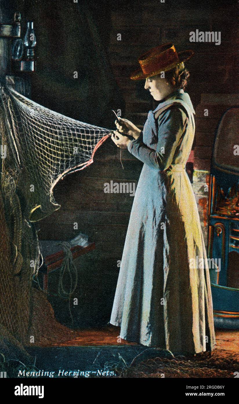 Women mending nets hi-res stock photography and images - Alamy