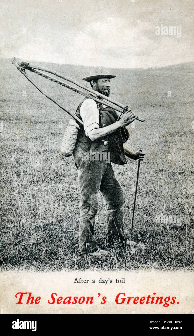 Farmer after a day's toil - he is carrying what appears to be some form ...