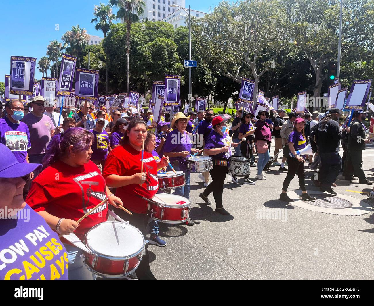 Los Angeles City workers march past city hall in downtown Los Angeles on Tuesday, Aug. 8, 2023 ...