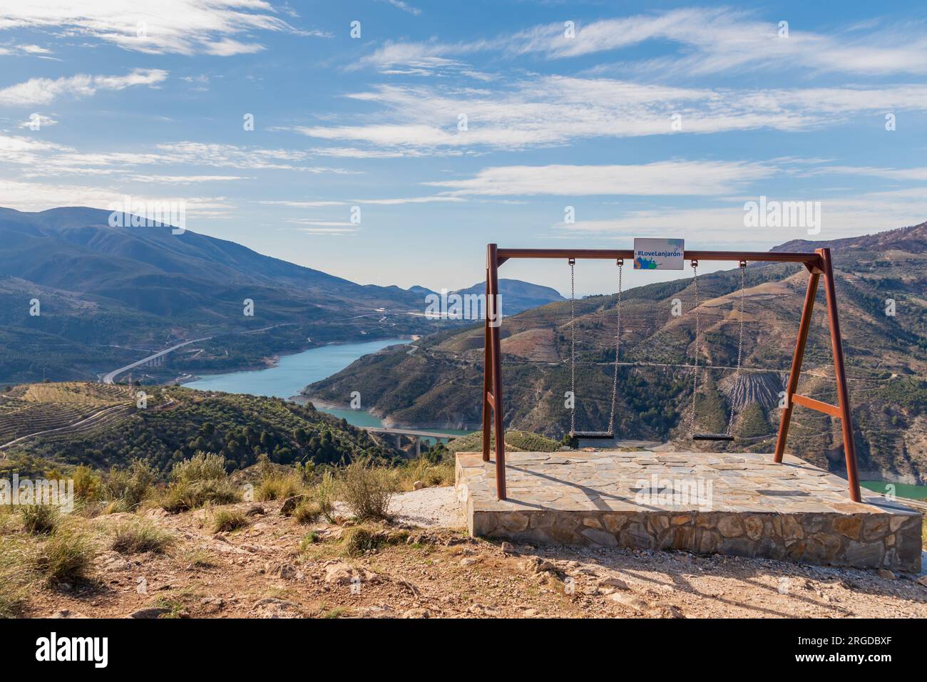 Swings at a viewpoint in Lanjaron with views of the Rules reservoir ...