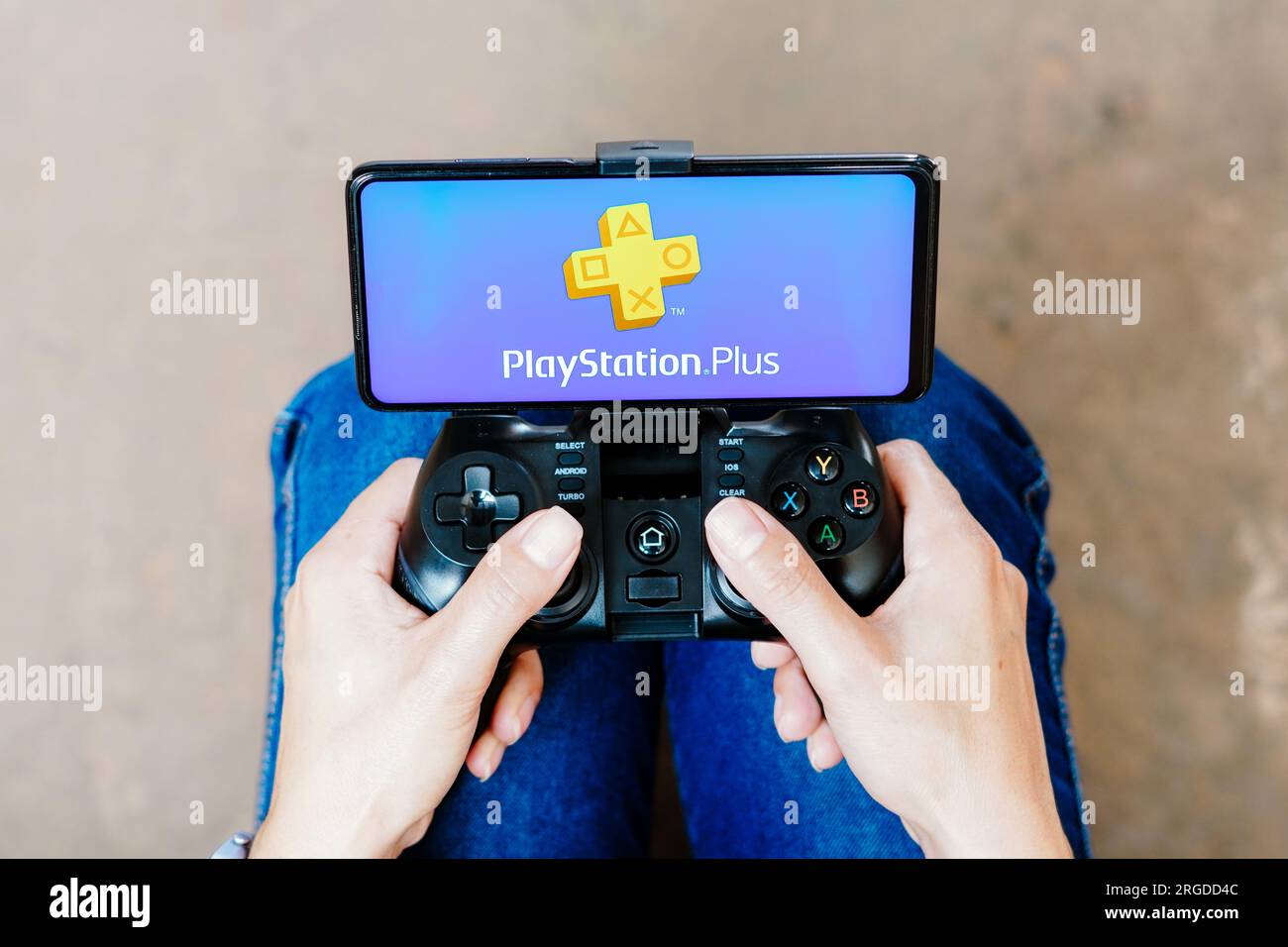 In this photo illustration, a person playing on a joystick and the ...