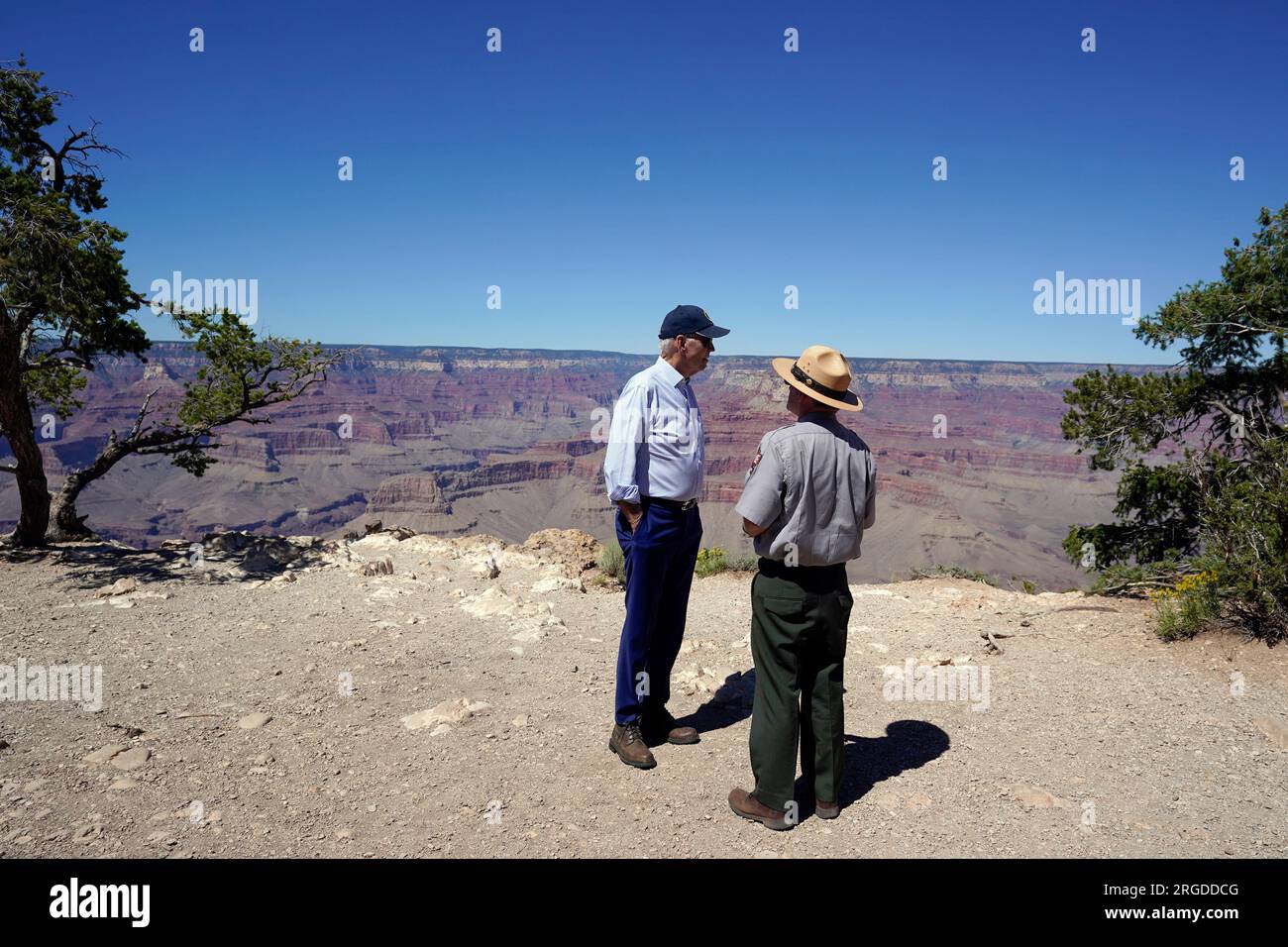 President Joe Biden talks with Ed Keable, superintendent of Grand ...