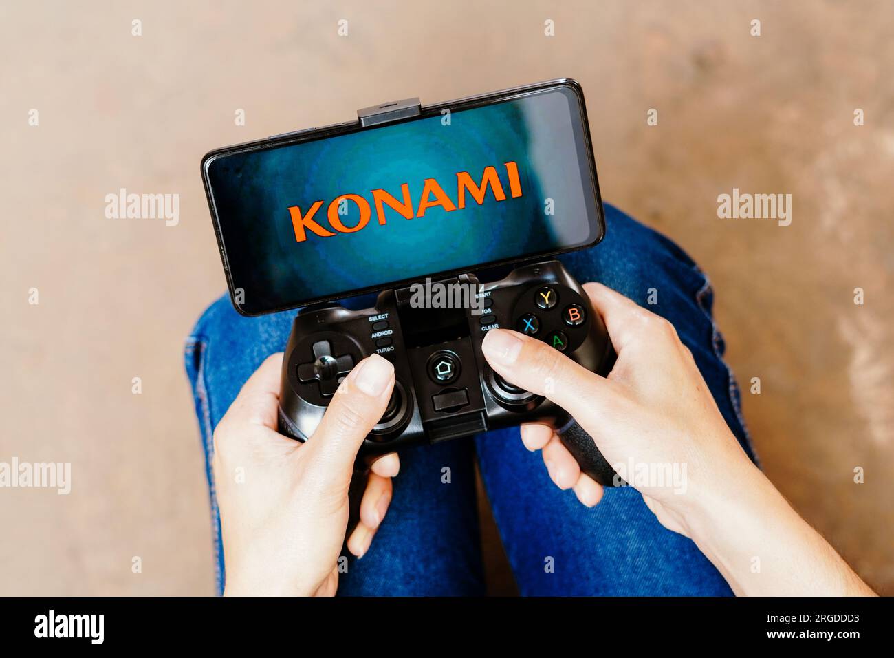 In this photo illustration, a person playing on a joystick and the ...