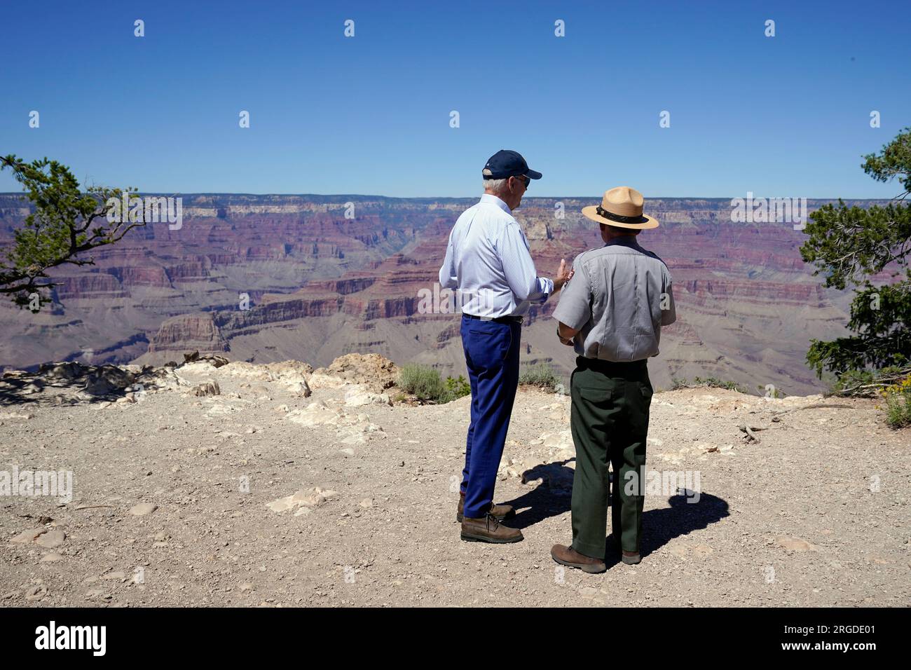 President Joe Biden talks with Ed Keable, superintendent of Grand ...