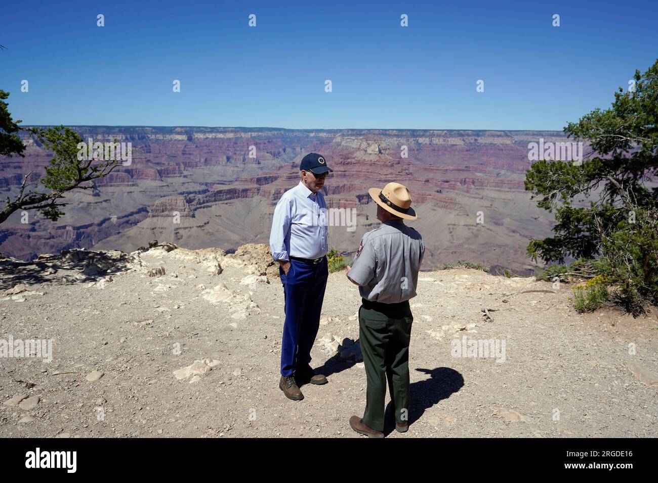 President Joe Biden talks with Ed Keable, superintendent of Grand ...