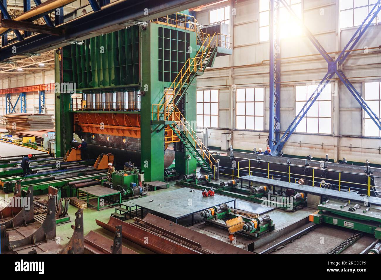 Pipe formation by roll sheet bending machine Stock Photo - Alamy