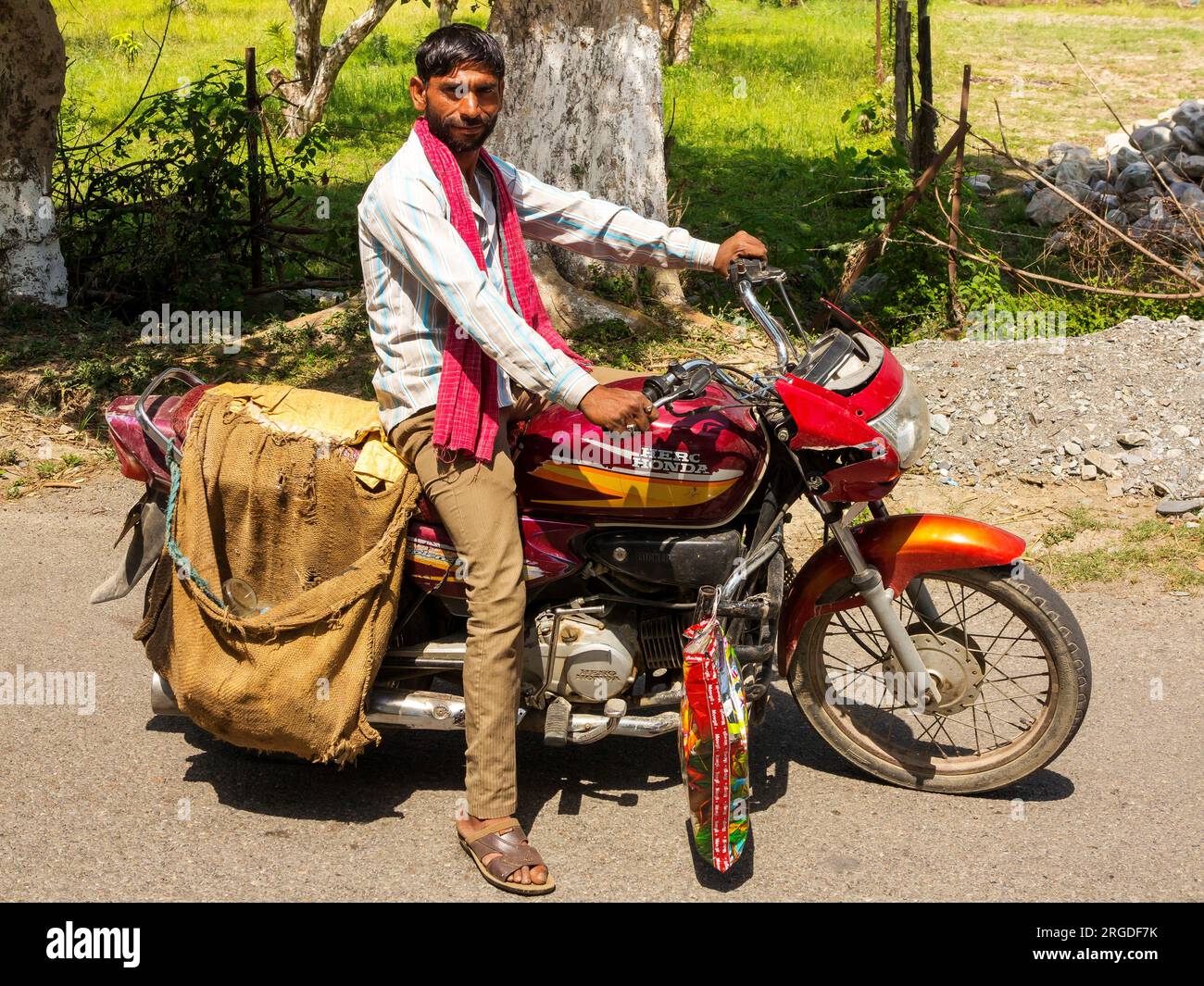 Indian man with his motorbike, Pawalgarh village, Uttarakhand, India ...