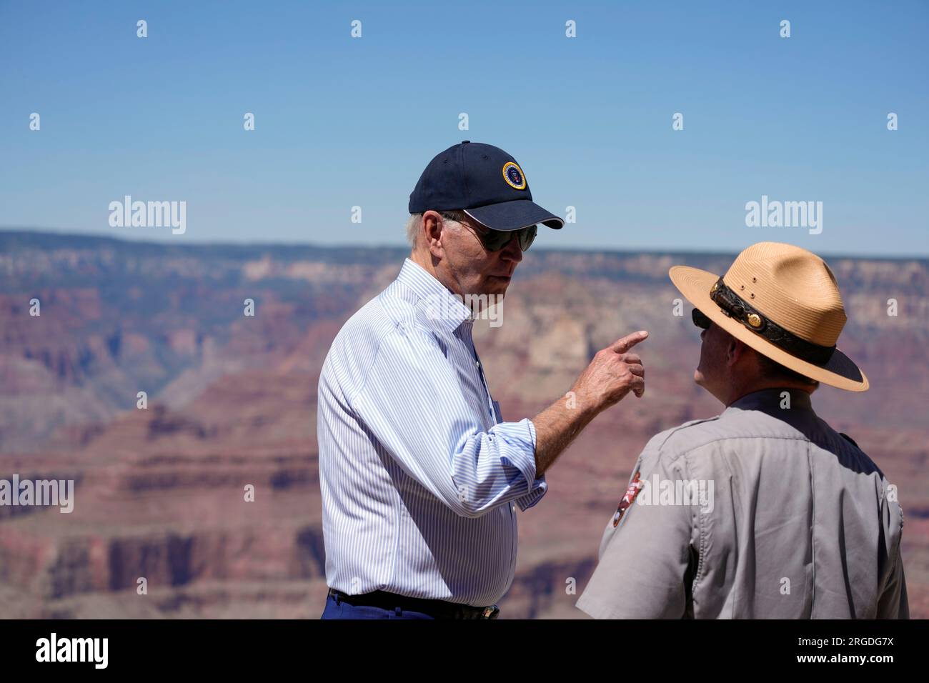 President Joe Biden talks with Ed Keable, superintendent of Grand ...