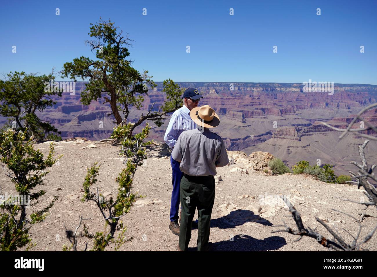 President Joe Biden talks with Ed Keable, superintendent of Grand ...
