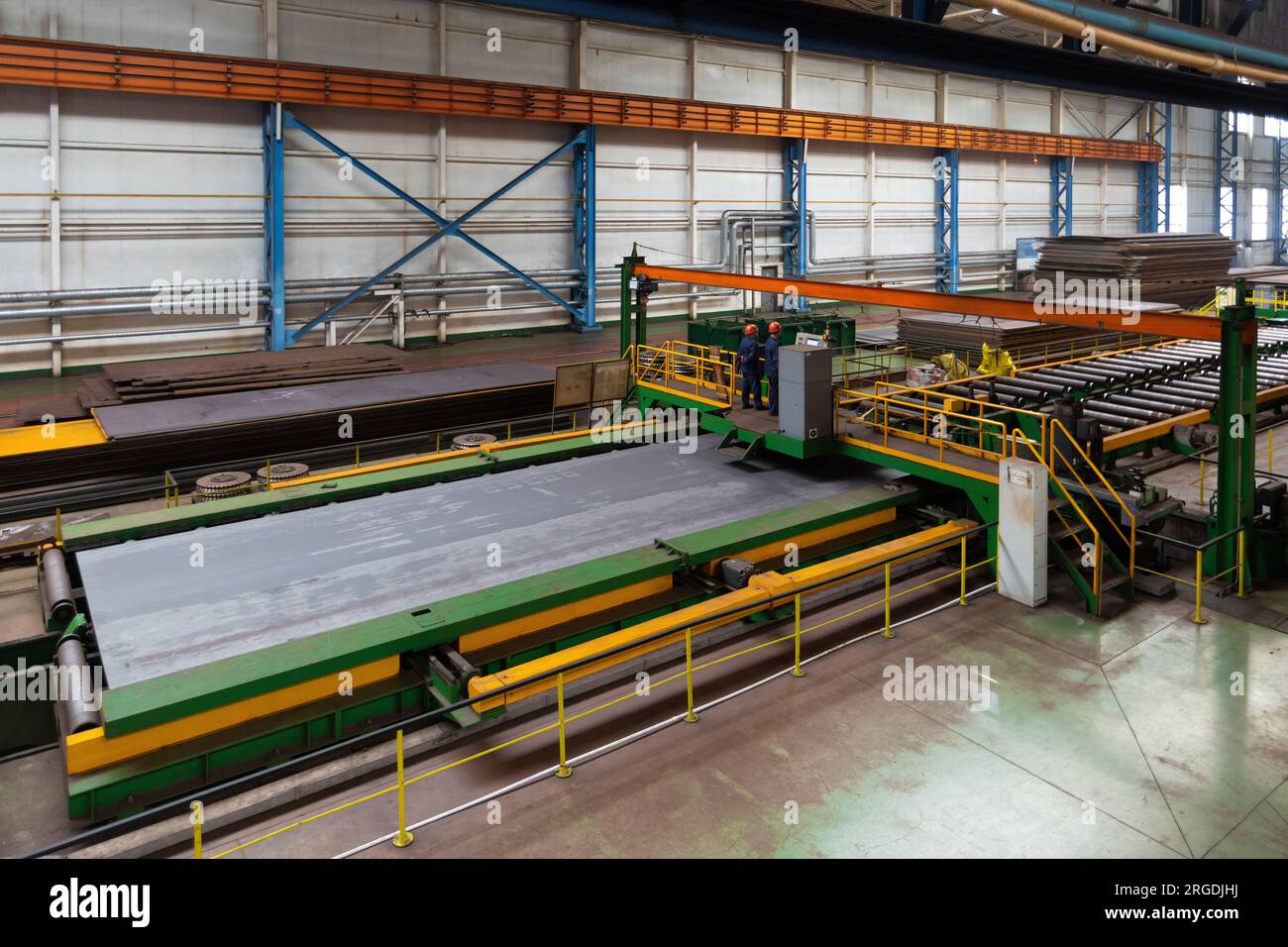 Steel sheet moving on roller conveyor in metalworking workshop Stock ...