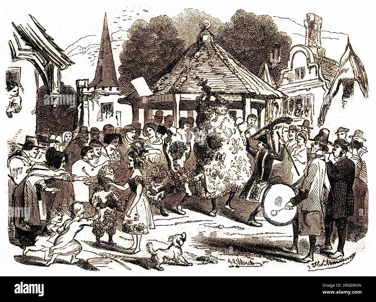 Villagers enjoy a May Day celebration as a Jack in the Green, a Lord of ...