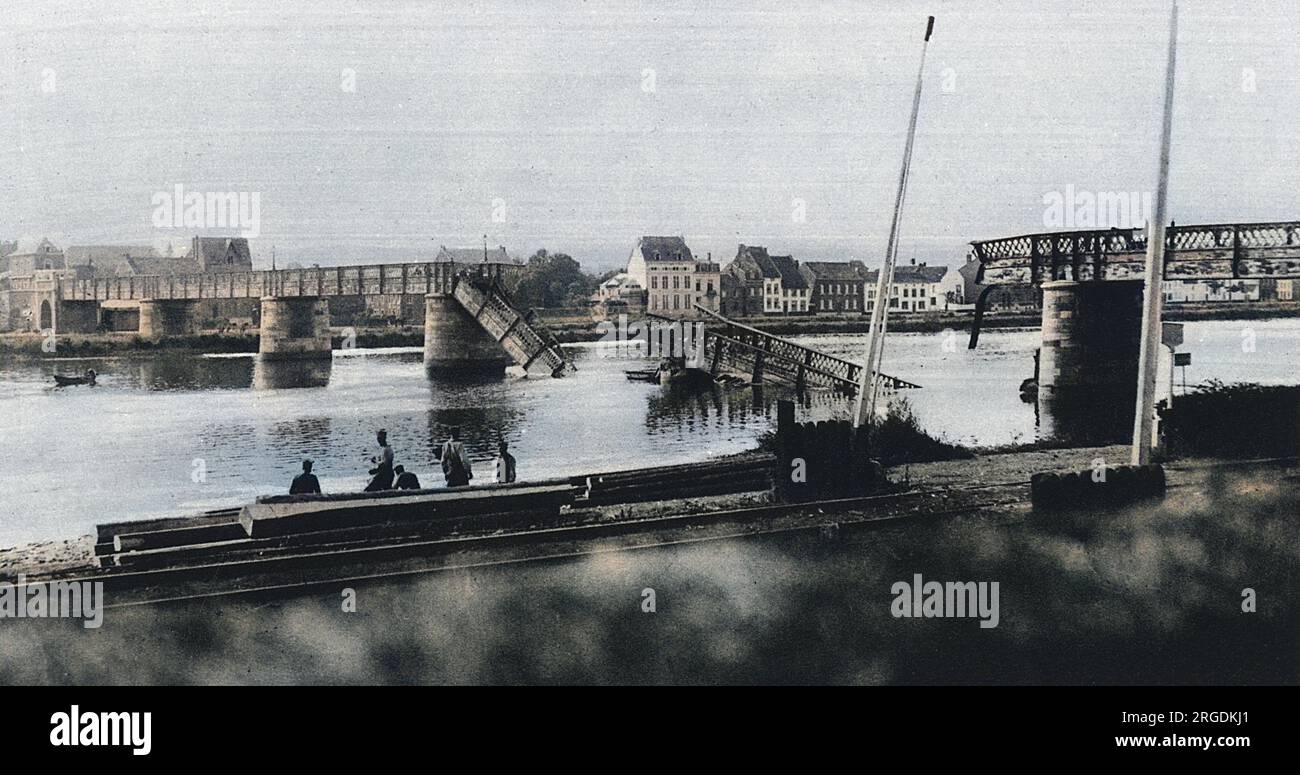 The wreck of the iron bridge across the Meuse at the Belgian town of ...