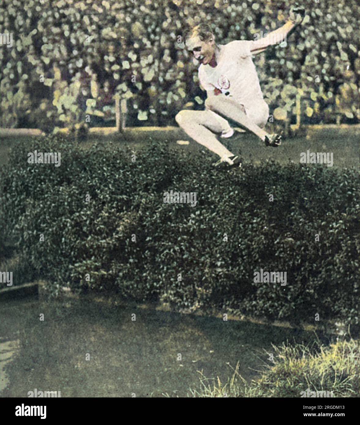 400 metres hurdles gold medallist, Lord Burghley, at the water jump in ...
