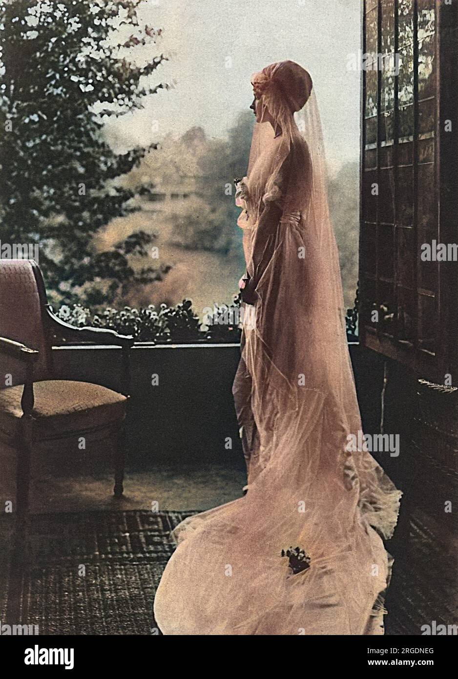 Artistic photograph showing a bride in veil and dress, looking ...