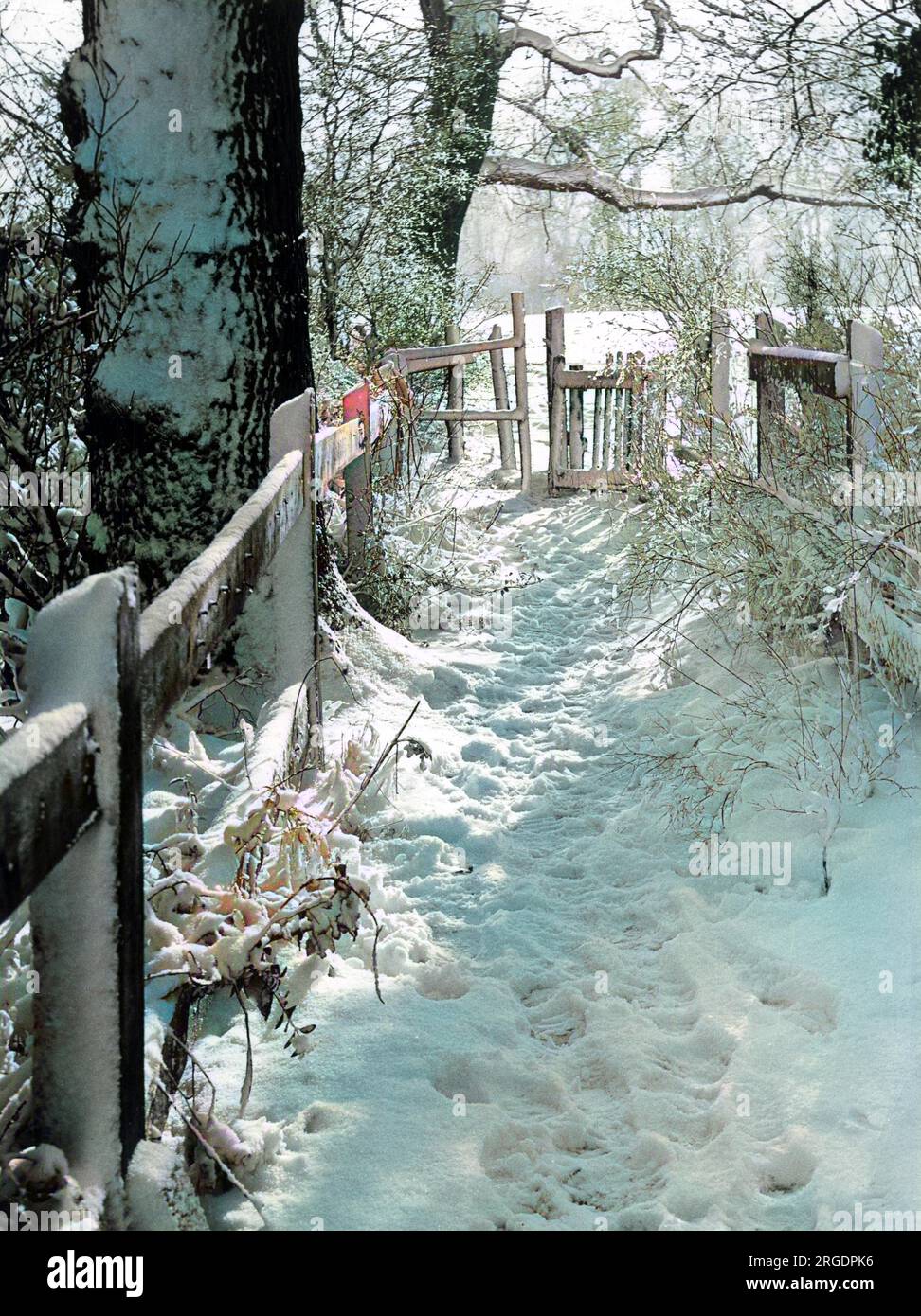 The Kissing Gate, a winter snow study Stock Photo - Alamy