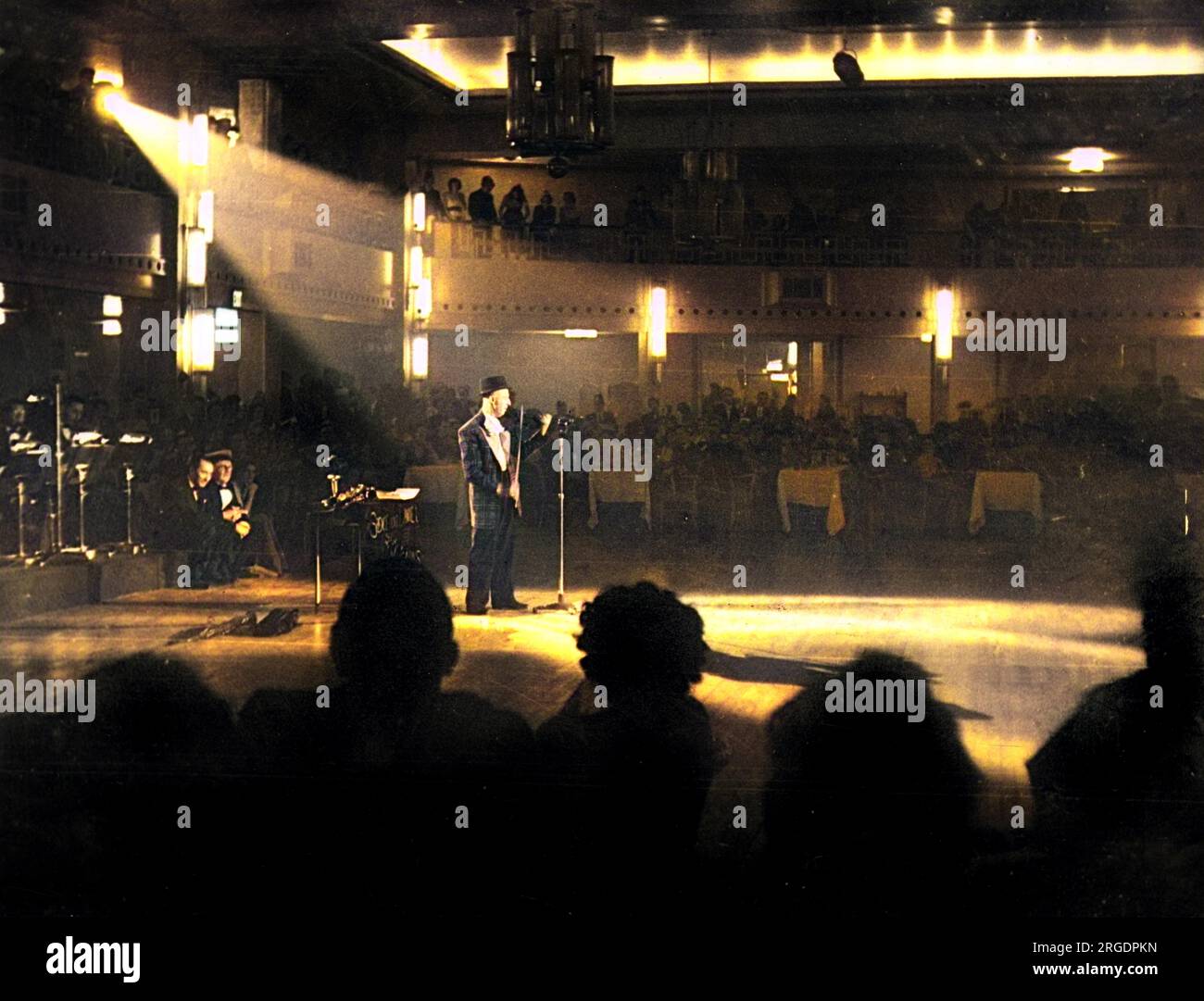 A stage musician peforms for guests at the Grosvenor House Hotel ...