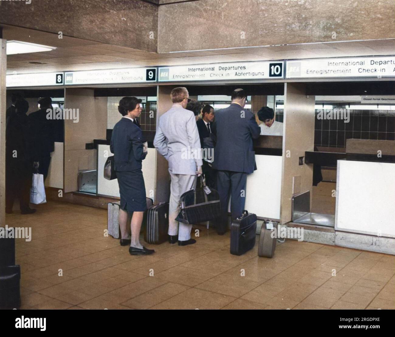 Passengers checking in at the International Departures desk in the ...