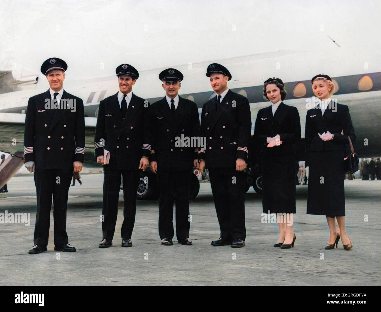 The Captain (extreme left), Cabin Crew and Air Hostesses of an Air ...