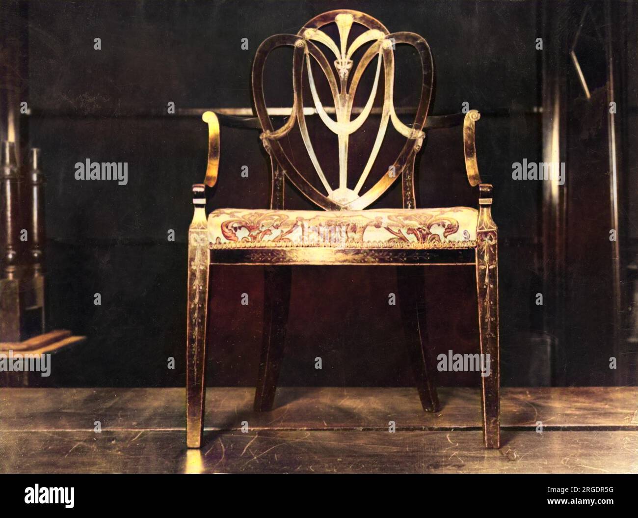 One of a set of George Hepplewhite painted elbow chairs, decorated with ...