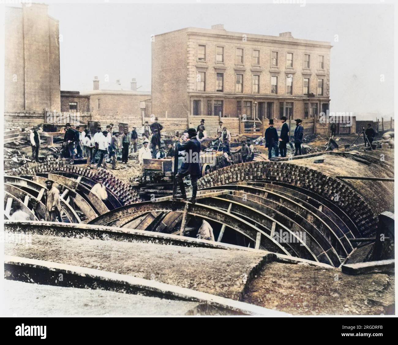 Construction workers and engineers work to build tunnels for one of the ...