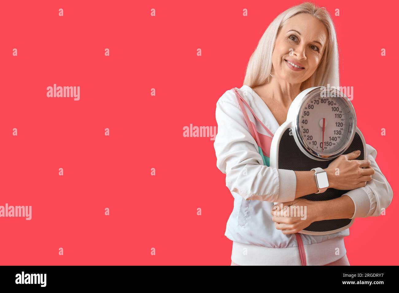 Mature woman scales happy hi-res stock photography and images - Alamy