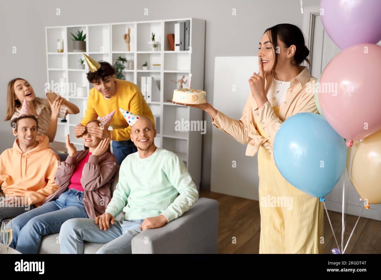 Young woman bringing Birthday cake to her friend at party Stock Photo ...