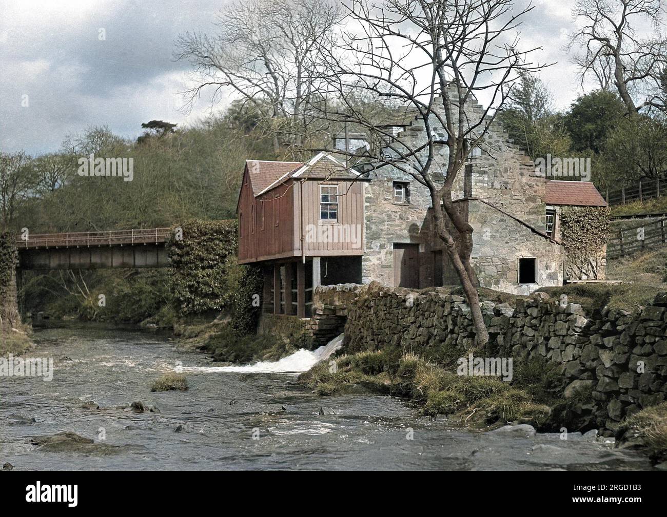 View of a mill at the side of a river Stock Photo - Alamy