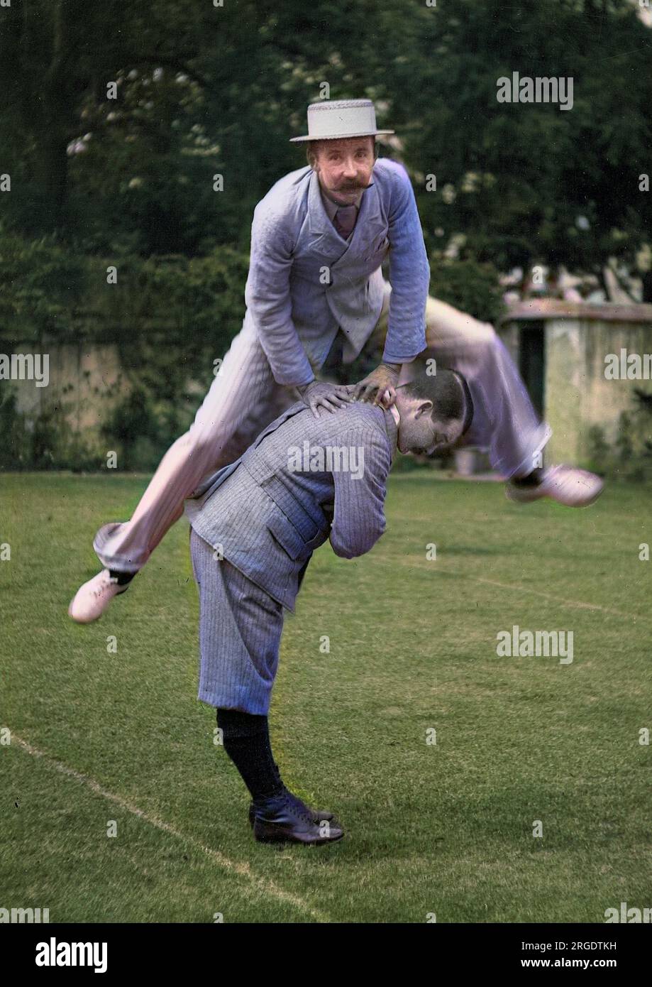 Two men playing leapfrog Stock Photo - Alamy