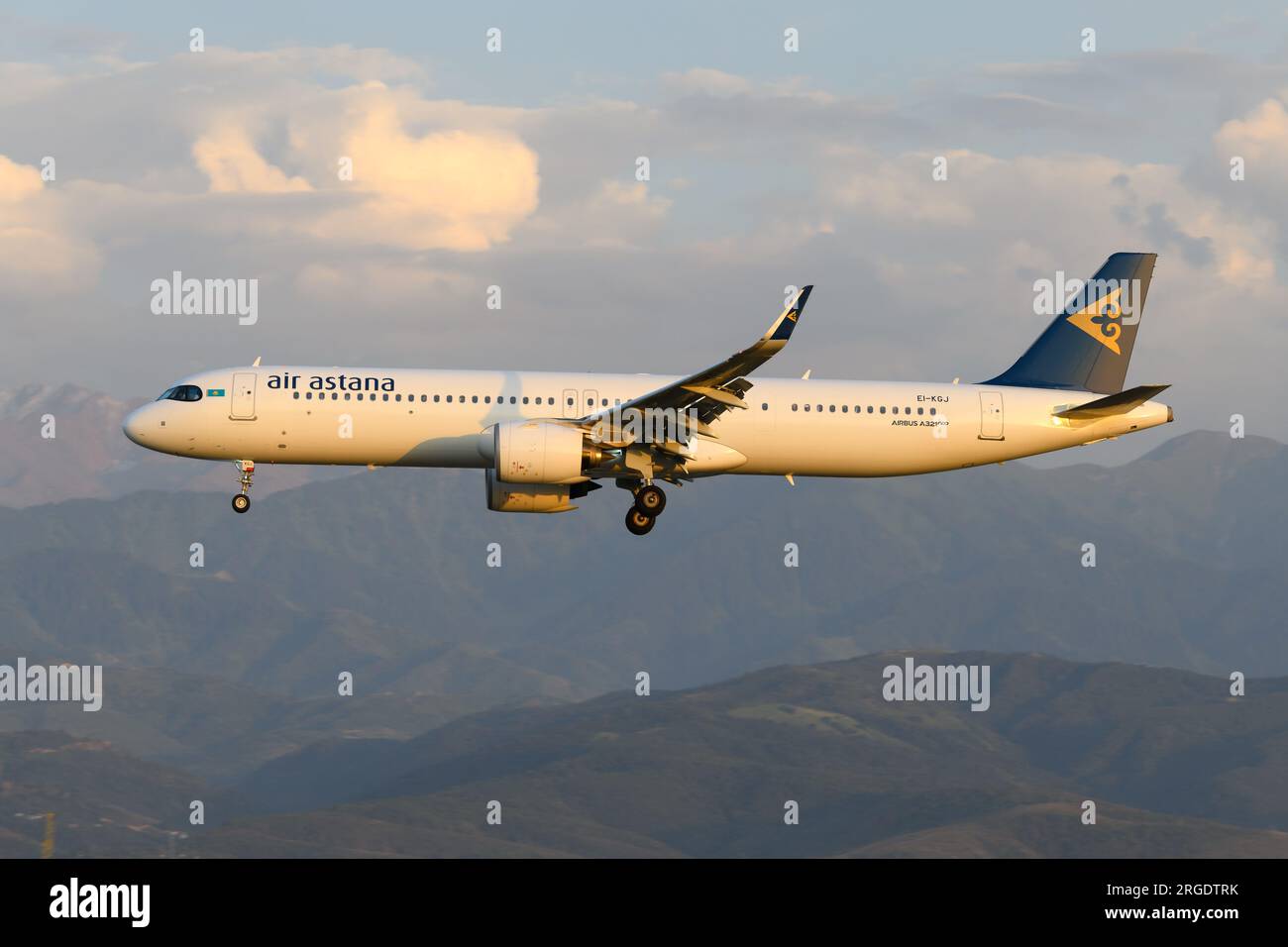 Air Astana Airbus A321neo aircraft about to land in Almaty Airport in Kazakhstan with mountains ...