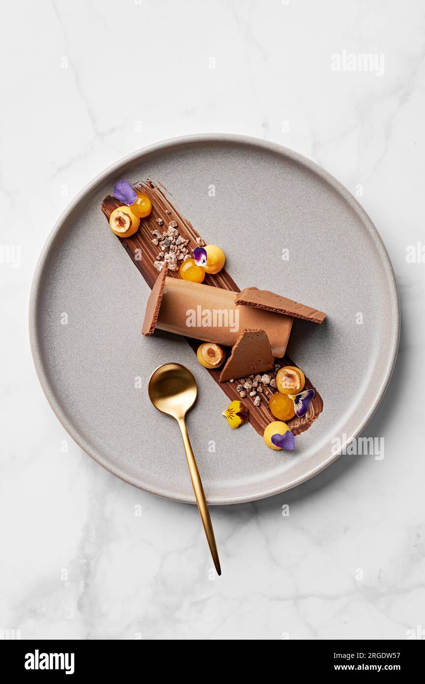 Chocolate mousse, passionfruit curd, candied hazelnuts, cacao nib ...