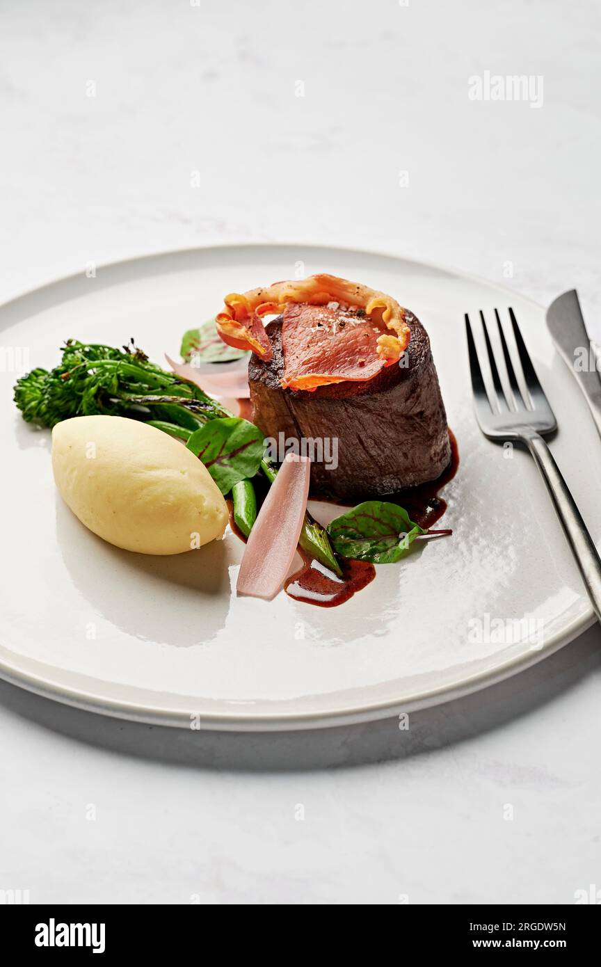 Eye fillet, mashed potato, charred broccolini, black truffle jus ...