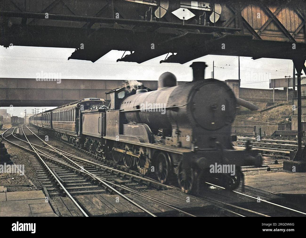 An LMS (London, Midland and Scottish) steam engine pulling carriages ...