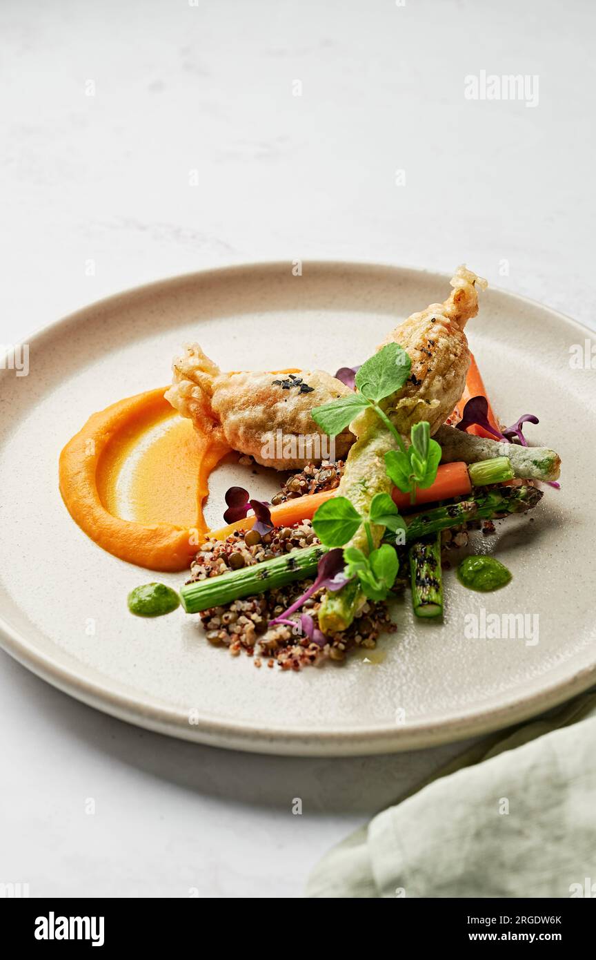 Stuffed zucchini flowers, carrot puree, salsa verde, charred asparagus ...