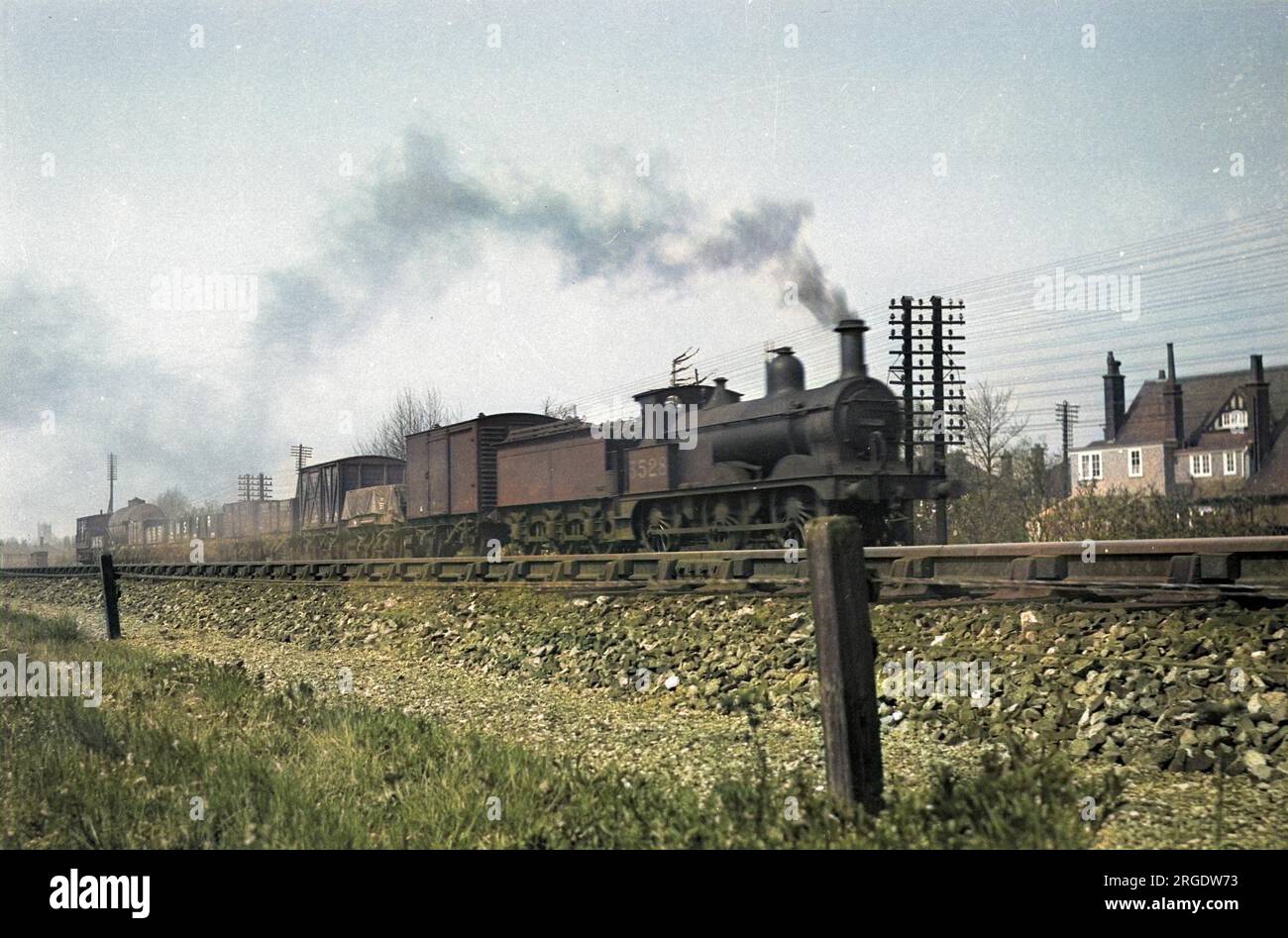 Steam engine, tender and trucks on a railway track Stock Photo - Alamy