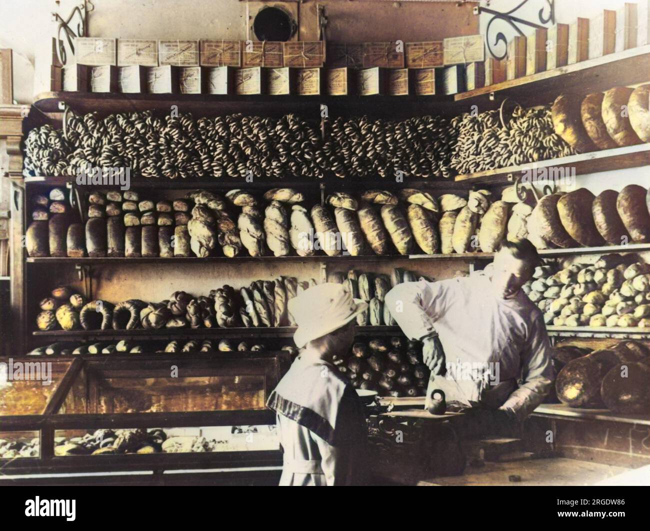 An early 20th century Leningrad Bakery, its shelves heavily laden with ...