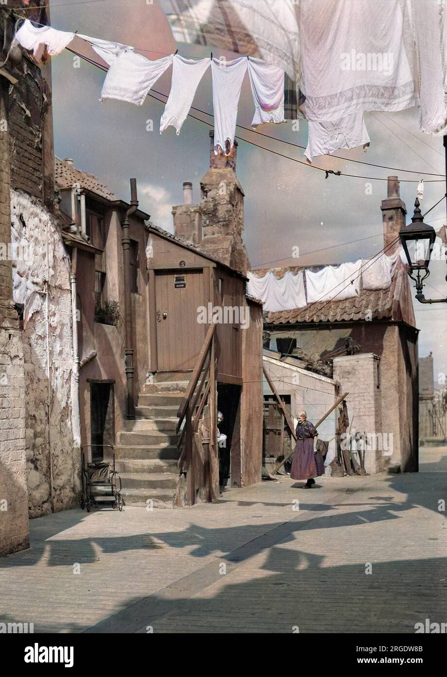 An Edinburgh street scene, showing two elderly neighbours chatting in ...