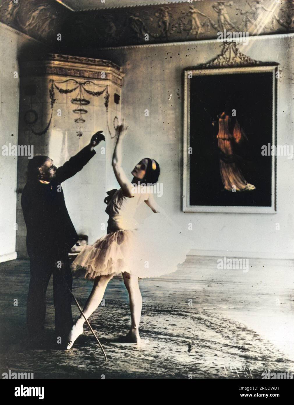 Anna Pavlova (1881 -1931) elegantly striking a pose under the watchful ...