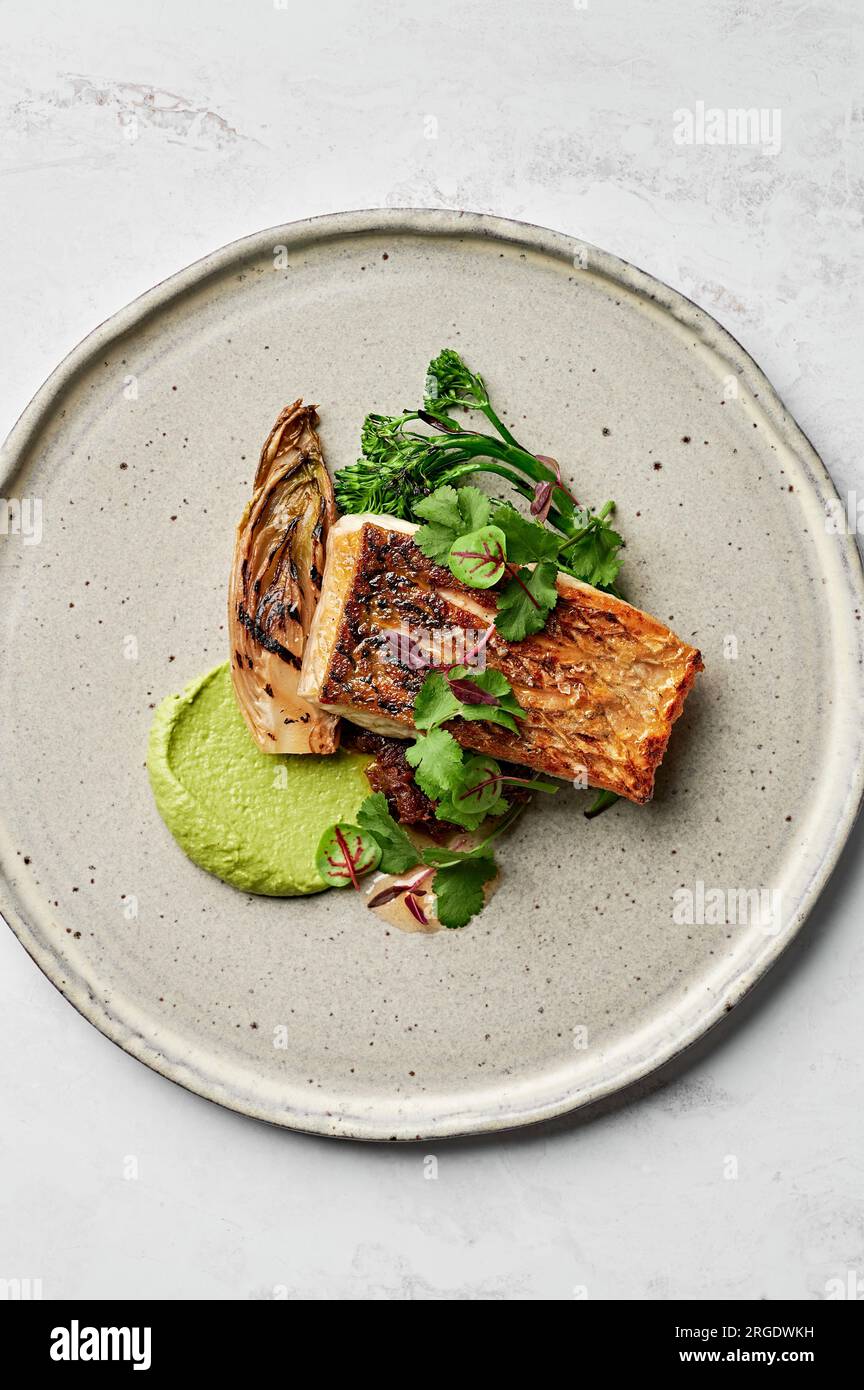 Barramundi fish, leek puree, seafood XO sauce, braised witlof, charred ...