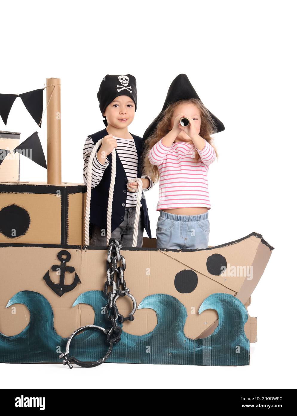 Cute little pirates playing in cardboard ship on white background Stock ...