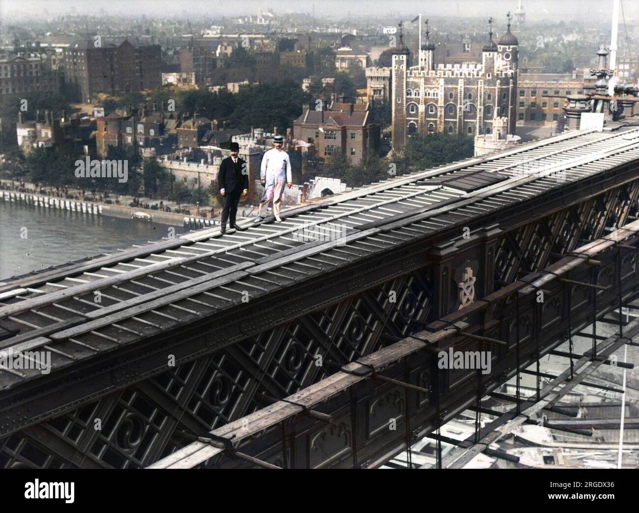 Two men in suits standing on top of one of the walkways over Tower ...