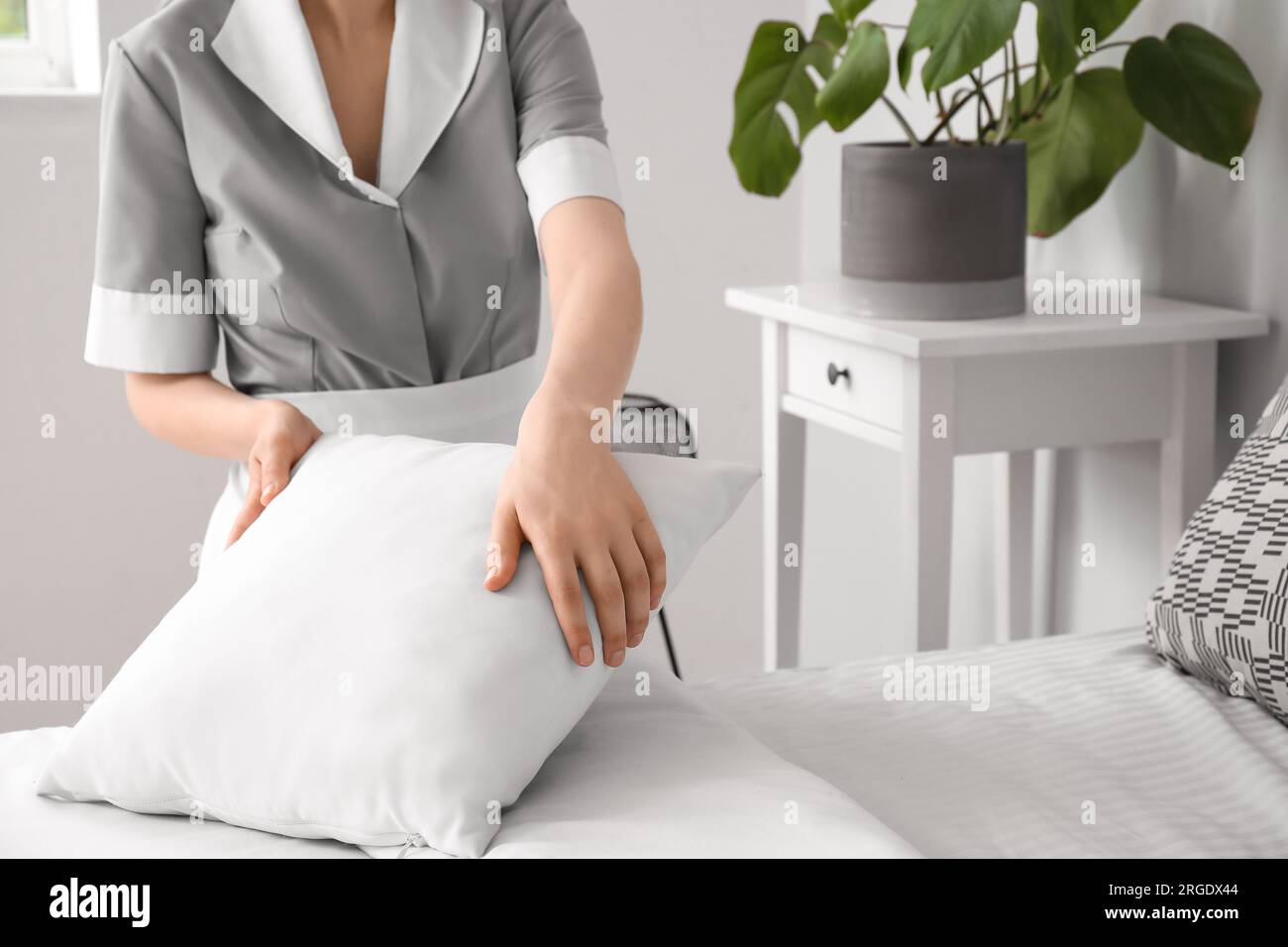 Stylish hotel room maid hi-res stock photography and images - Alamy