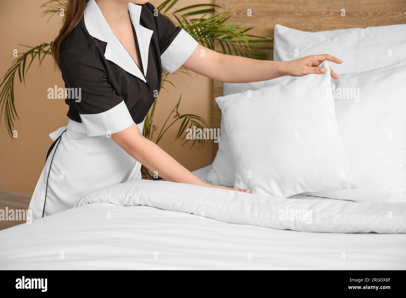 Stylish hotel room maid hi-res stock photography and images - Alamy