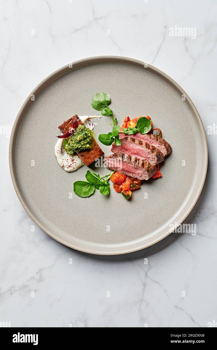 Char-grilled lamb backstrap, pressed lamb shoulder, honey lemon yoghurt ...