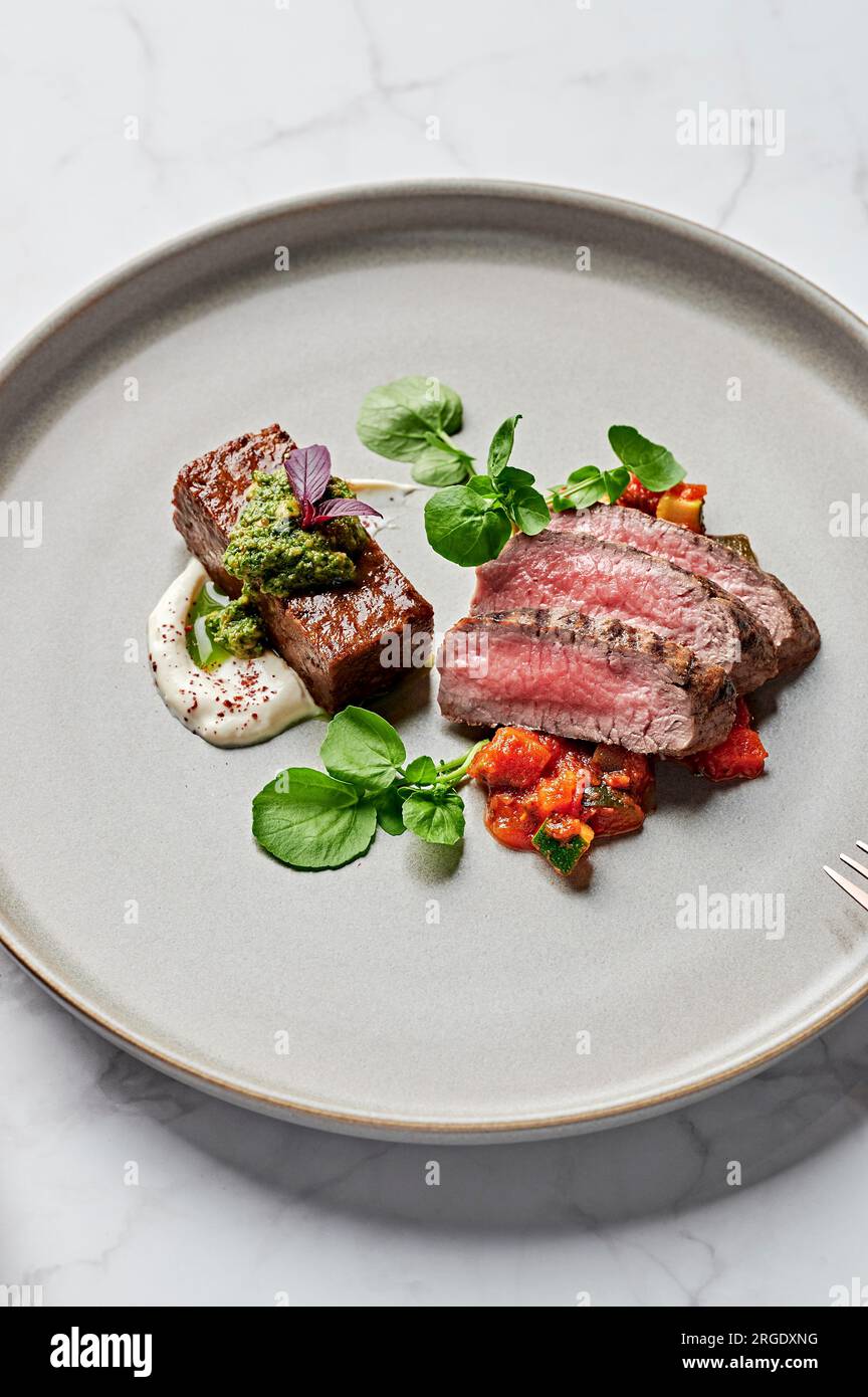 Char-grilled lamb backstrap, pressed lamb shoulder, honey lemon yoghurt ...